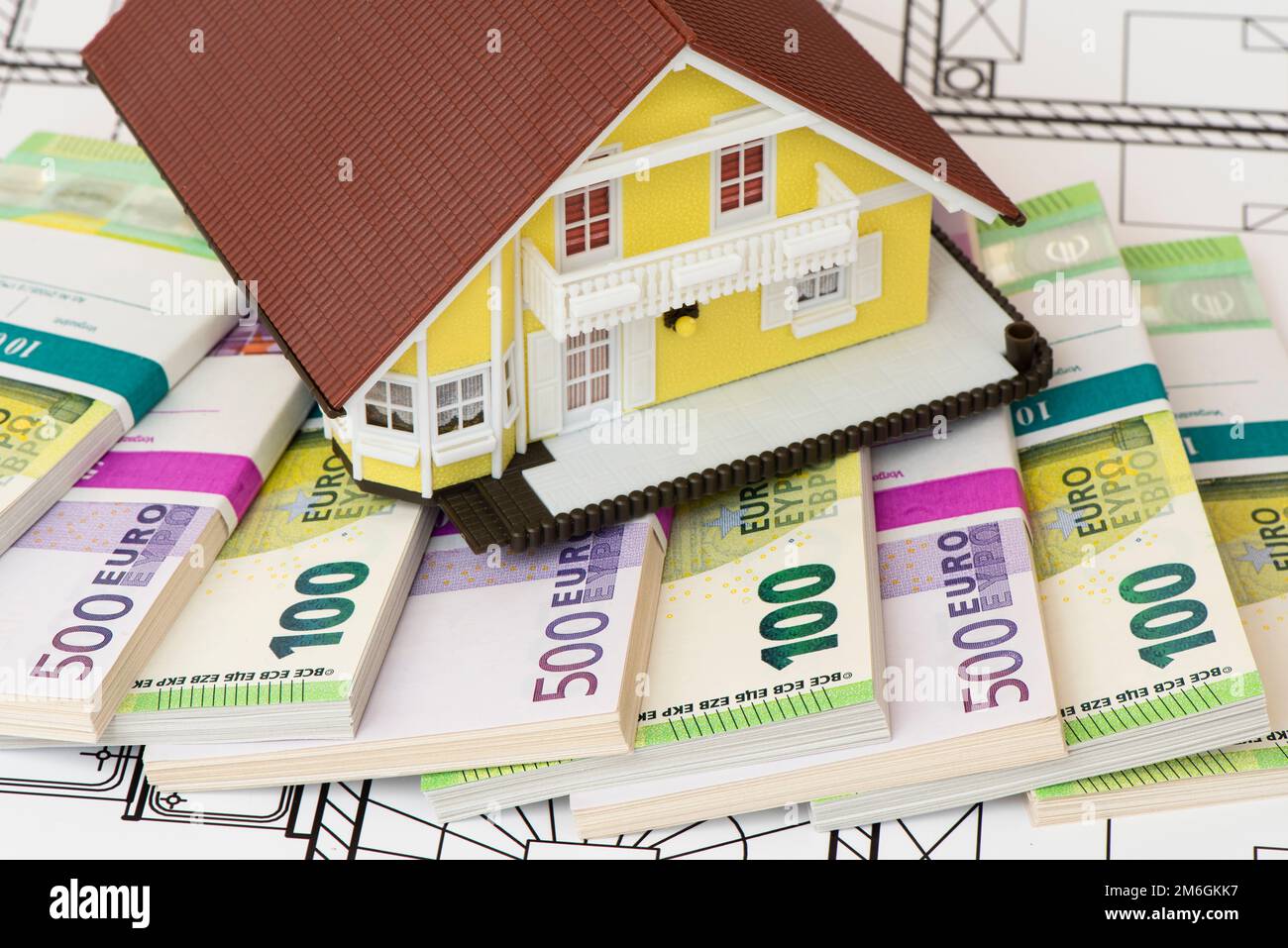 Model house stands on euro money bundle Stock Photo - Alamy