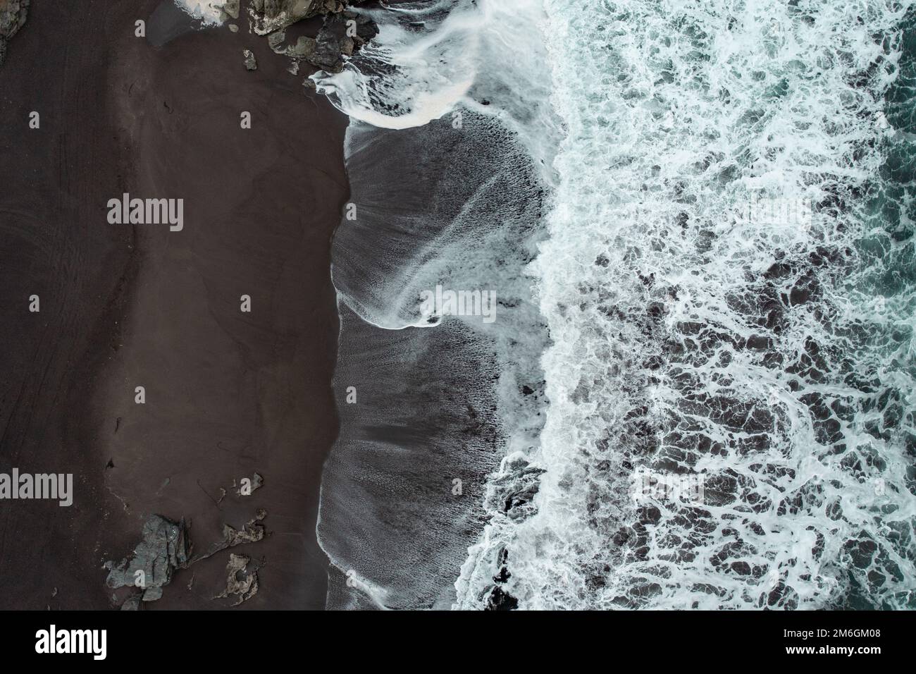 Aerial view of chilean ocean with black snd beach. Top view from drone ...