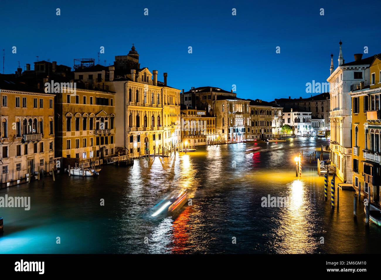 Venice canal waters, buildings and water taxis blur with long exposure ...