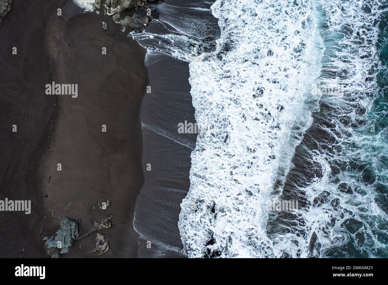 Aerial view of chilean ocean with black snd beach. Top view from drone ...