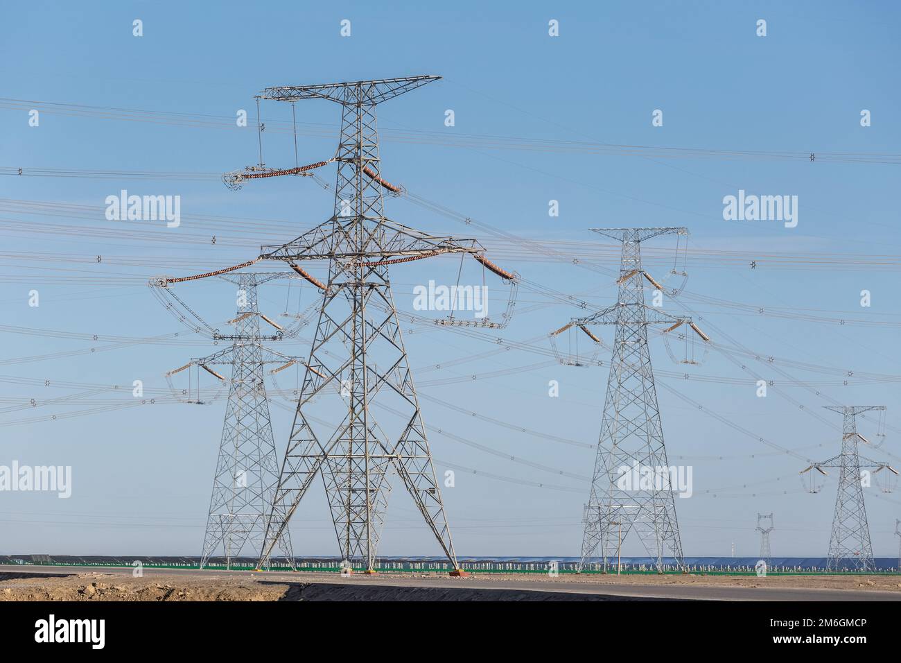 Power transmission tower on solar farm Stock Photo - Alamy