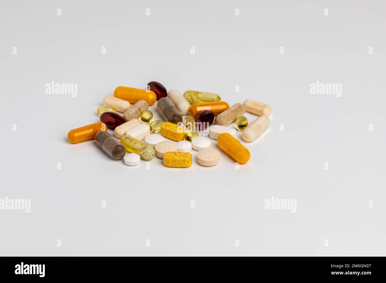 Variety of vitamins and nutritional supplements isolated on white ...