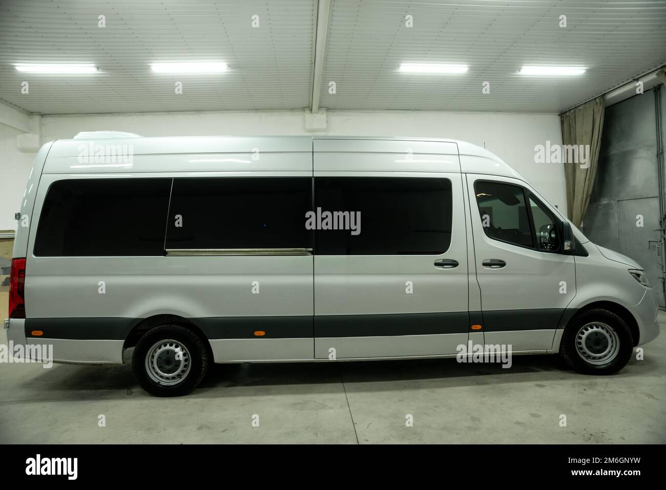 comfortable passenger bus interior with upholstered seats; individual ...