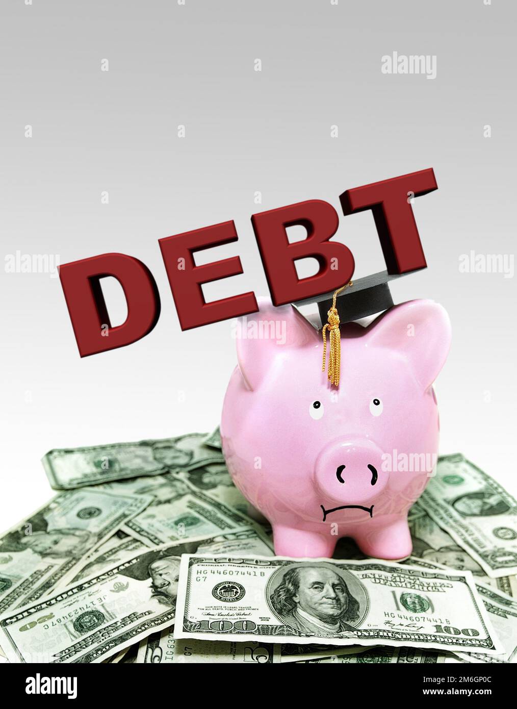 Frowning piggy bank under Debt text with graduation cap, on a pile of ...