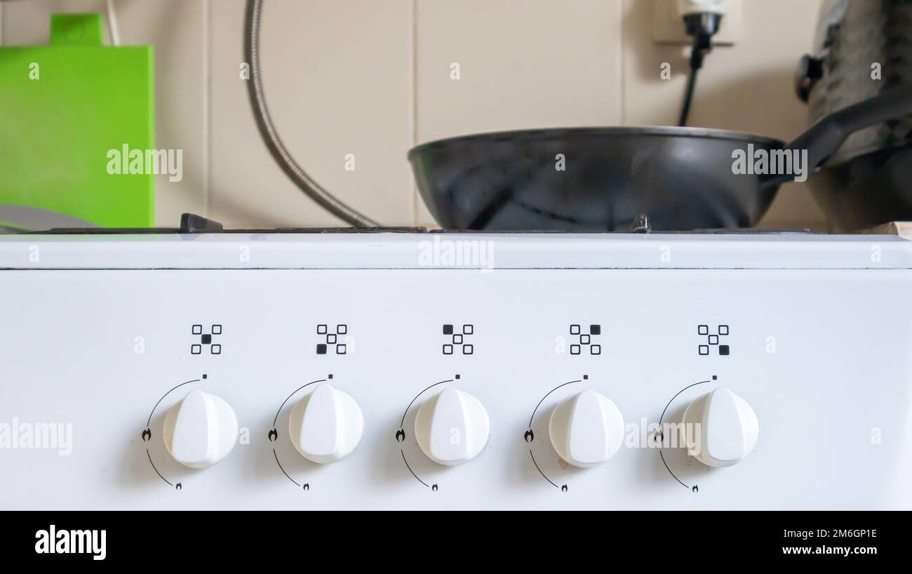 Gas stove. Not a new white gas stove in the interior of the kitchen ...