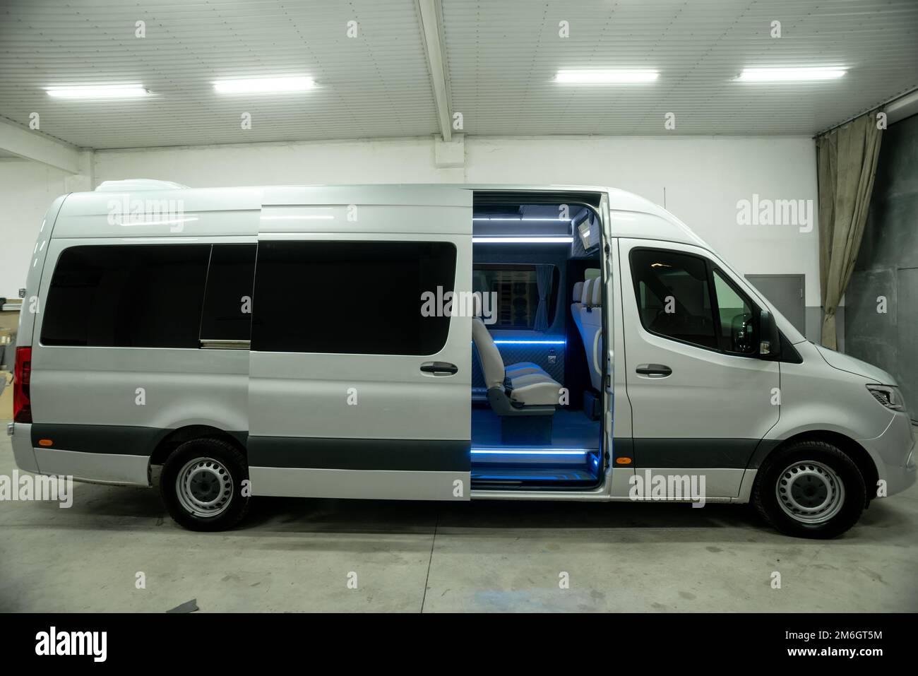 comfortable passenger bus interior with upholstered seats; individual ...