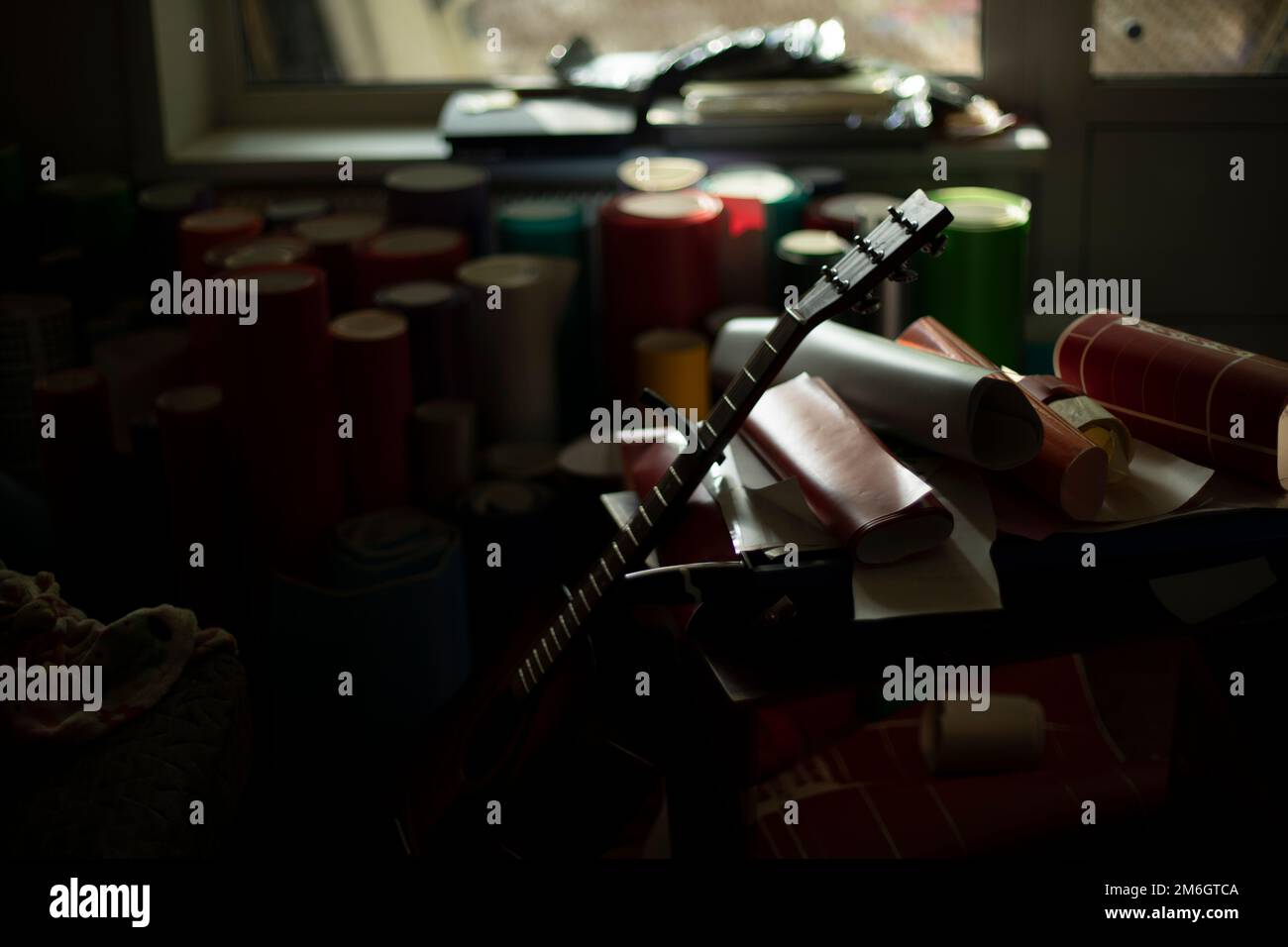 Guitar neck in room. Things in apartment. Morning mess. Disorder ...