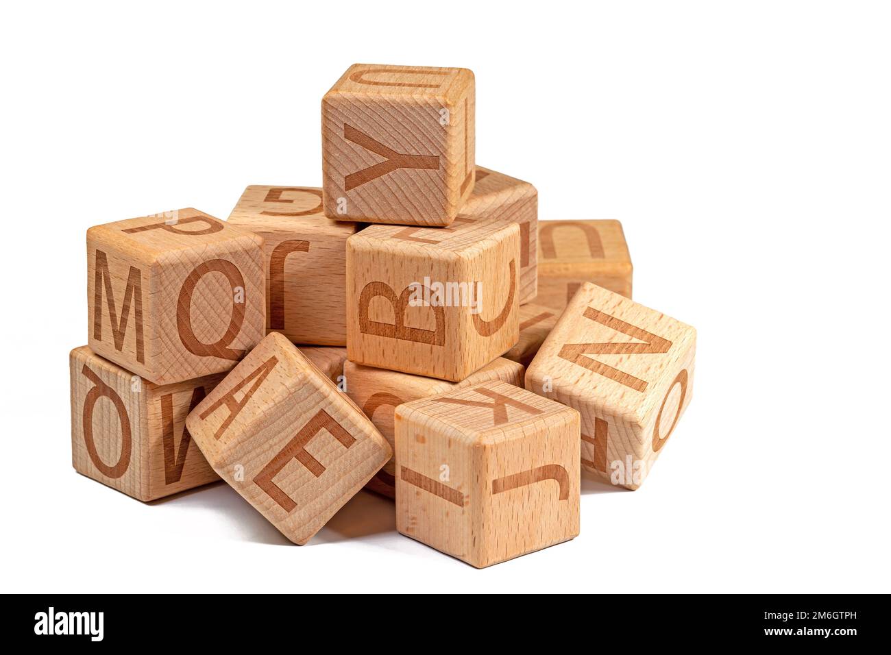 Wooden cubes with letters against a white background Stock Photo - Alamy