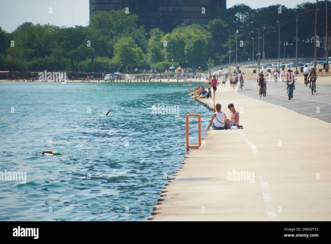 People relax on the Chicago lakeshore by Ohio Street Beach and Nav ...