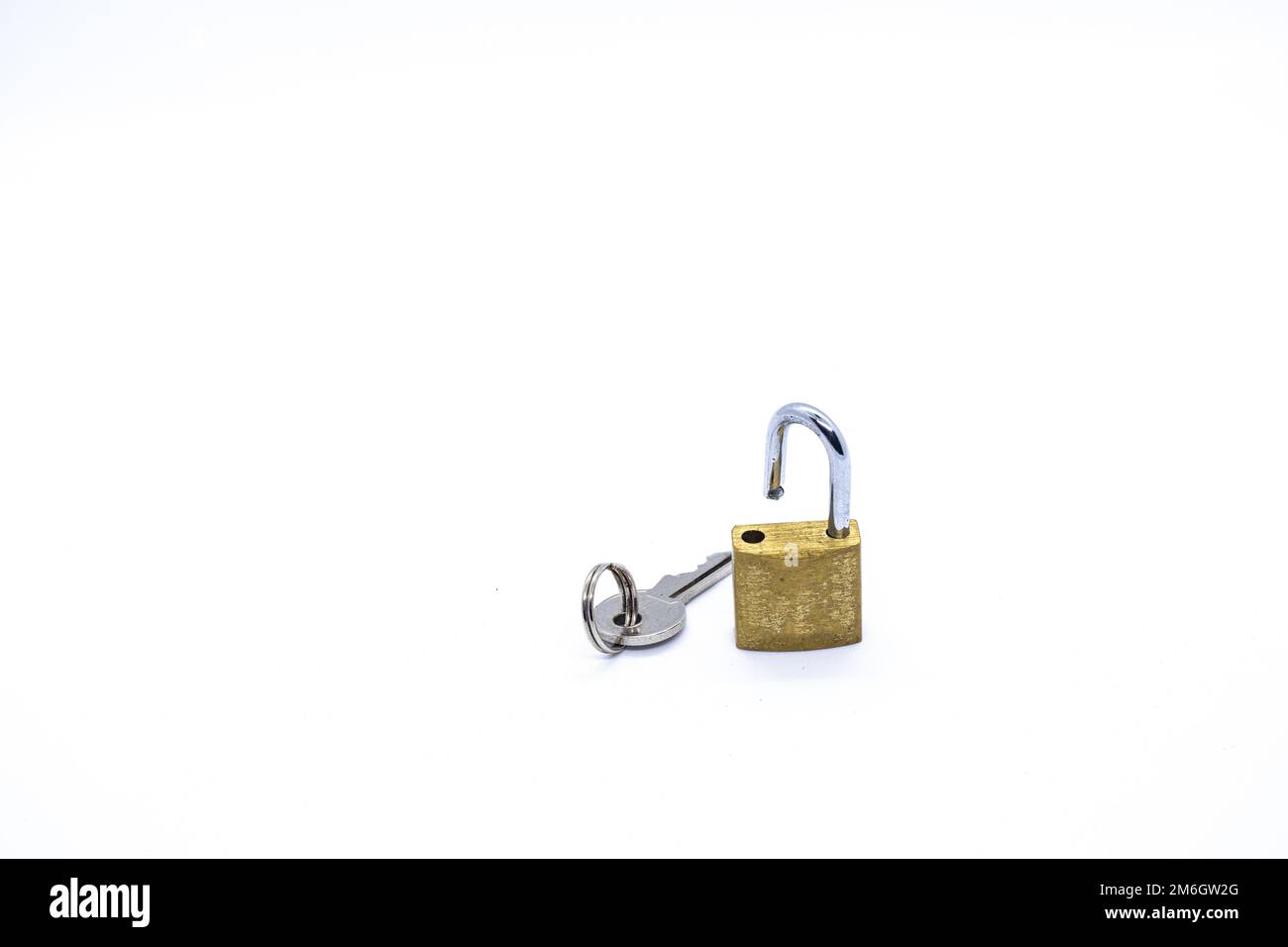 Lock with key on white background Stock Photo - Alamy