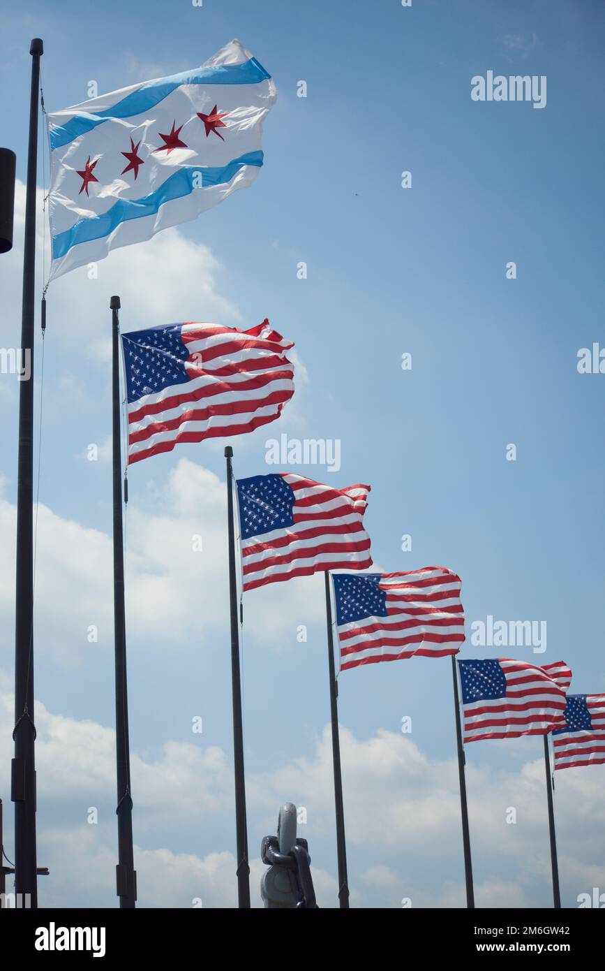 The flag of Chicago flies on Navy Pier in front of four american flags ...
