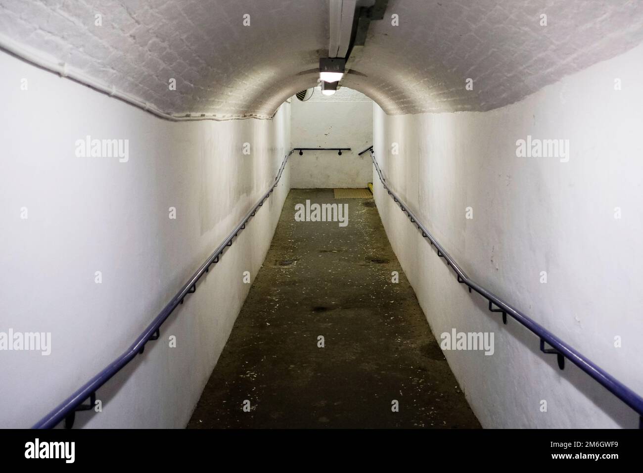 An empty underground subterranean railway station passage walkway Stock ...