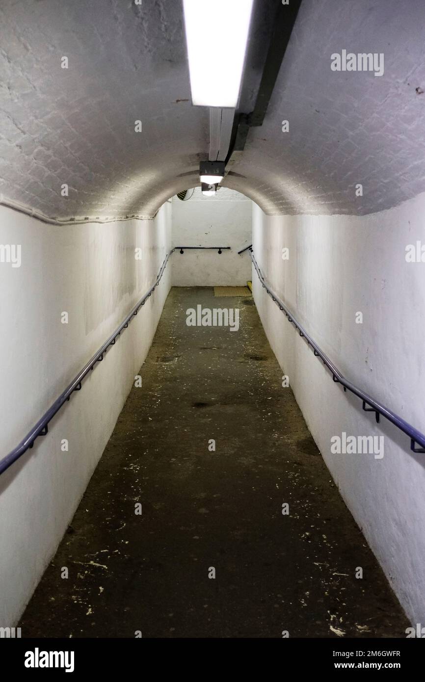 An empty underground subterranean railway station passage walkway Stock ...