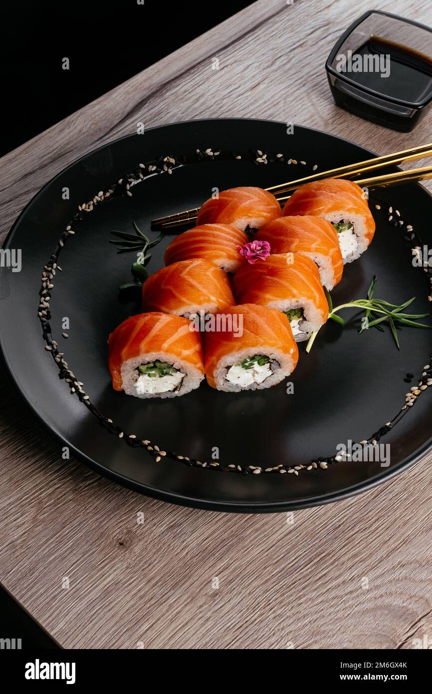 philadelphia sushi roll on a plate. asian restaurant menu Stock Photo ...