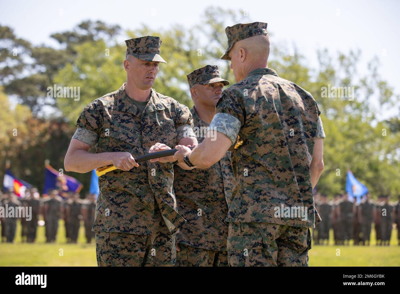 U.S. Marine Corps Sgt. Maj. Clifford Fincham, left, passes Col. David ...