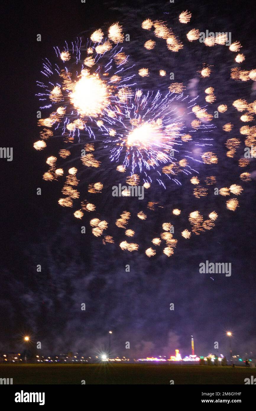 A long exposure with slow shutter speed of Fireworks exploding in the ...