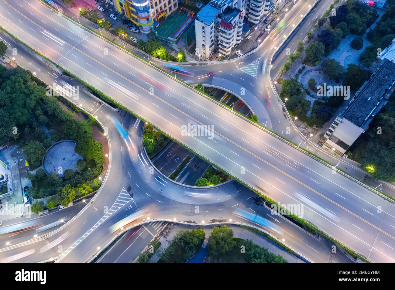 Small circular urban overpass in nightfall Stock Photo - Alamy