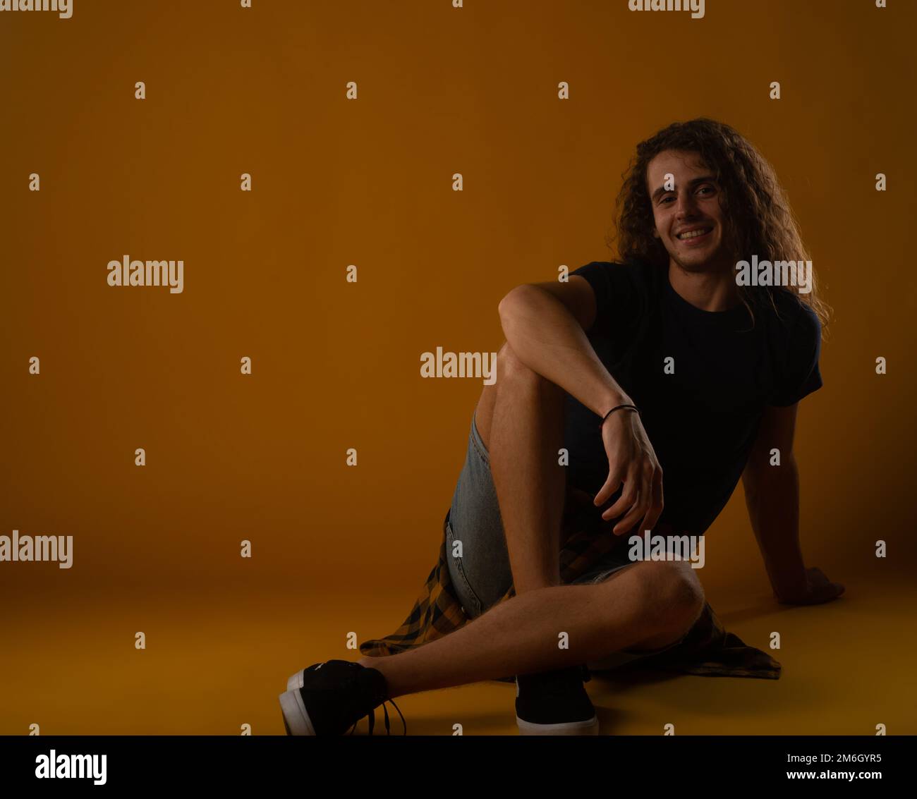 Fit and good looking male posing and smiling for the camera in the ...