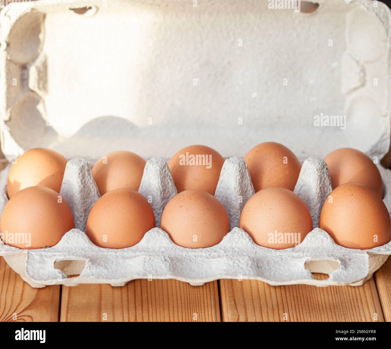 A few brown eggs among the empty cells of a large cardboard bag Stock ...
