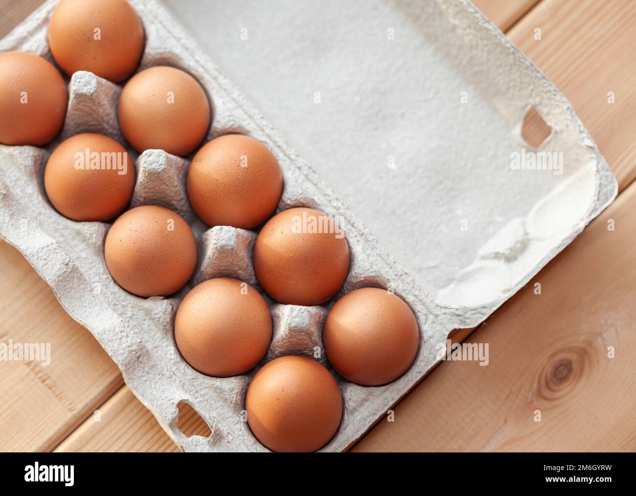 A few brown eggs among the empty cells of a large cardboard bag Stock ...