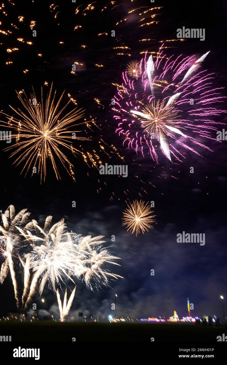 A long exposure with slow shutter speed of Fireworks exploding in the ...