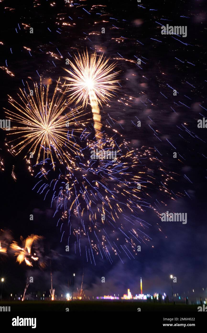 A long exposure with slow shutter speed of Fireworks exploding in the ...