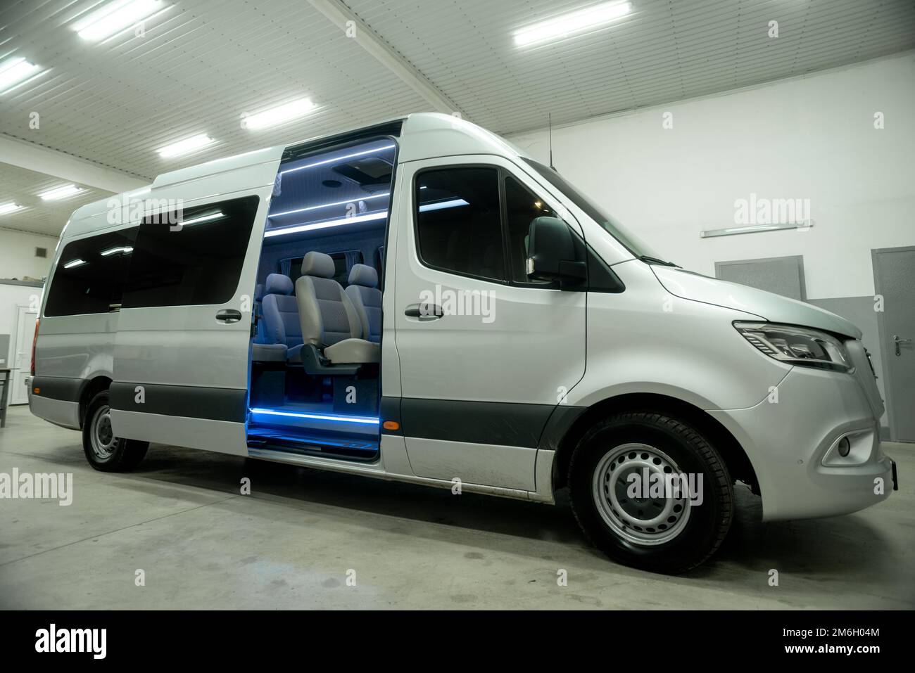 comfortable passenger bus interior with upholstered seats; individual ...