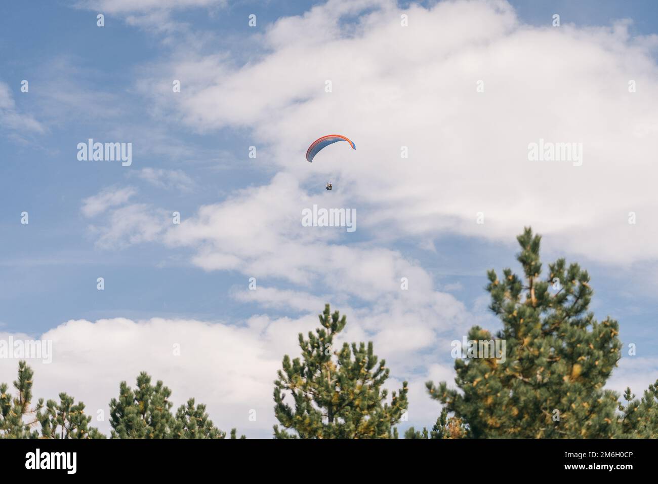 Two people flying with parachute. Professional skydiving Stock Photo ...