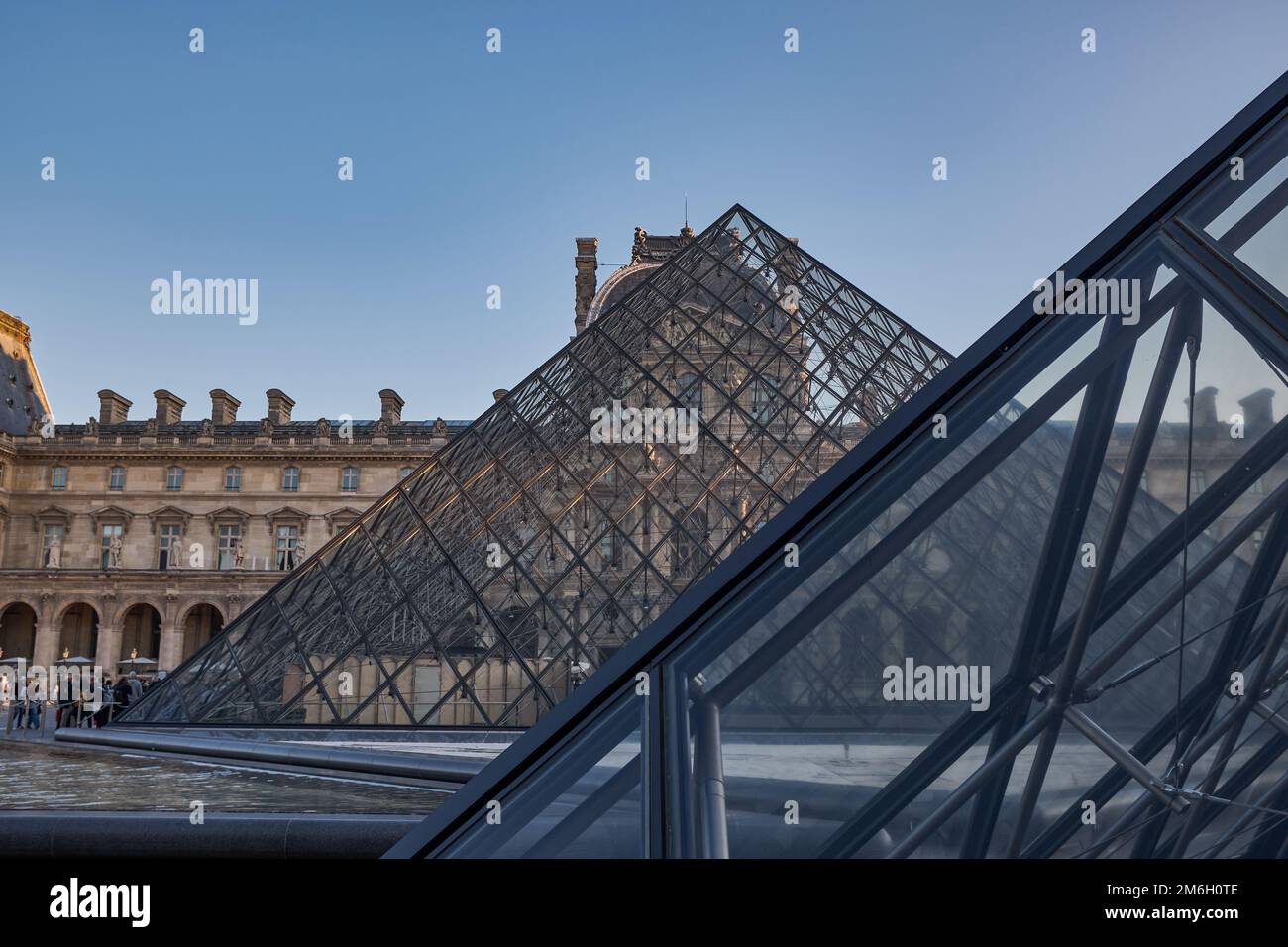 View of the famous Louvre museum and glass Pyramid at sunrise. The most ...