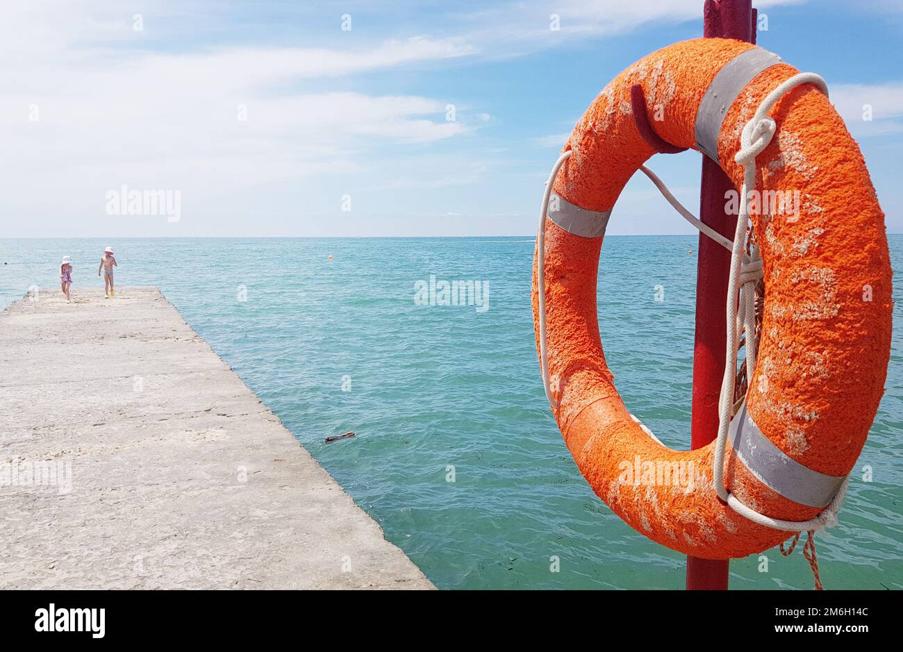 Lifebuoy close-up on the pier against the background of the sea Stock ...