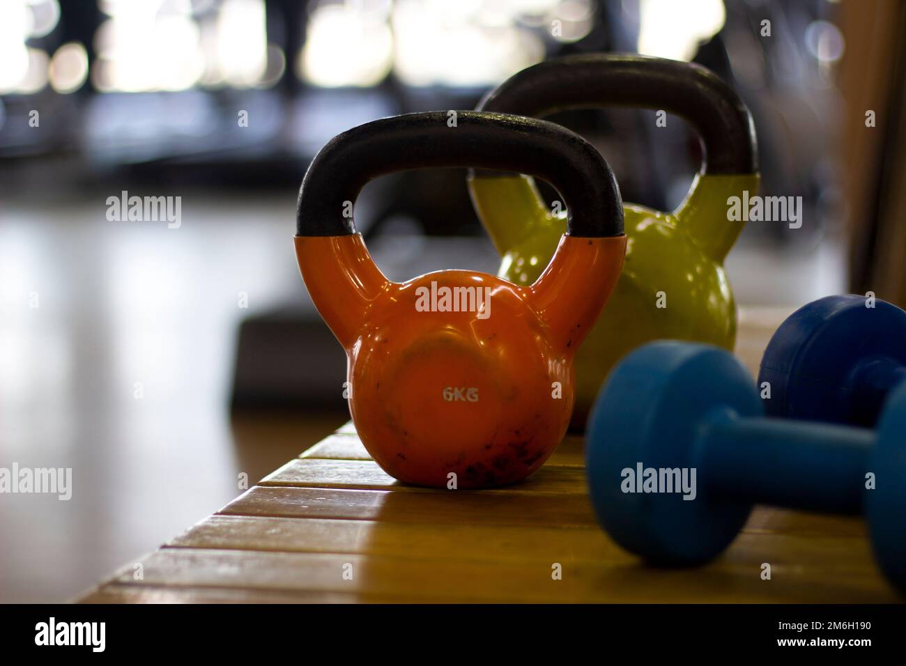 Cast iron weightlifting fitness weights arranged inside a fitness ...
