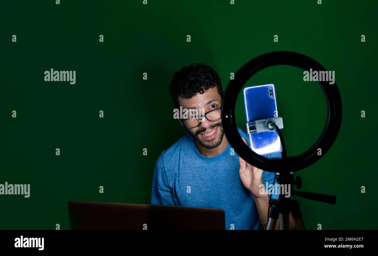 Student receiving online classes. Man receiving online classes with ...