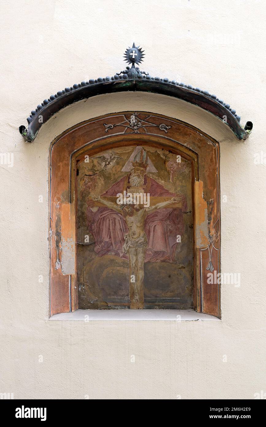 Religious oil fresco in a wall niche with canopy, moated castle am Inn ...