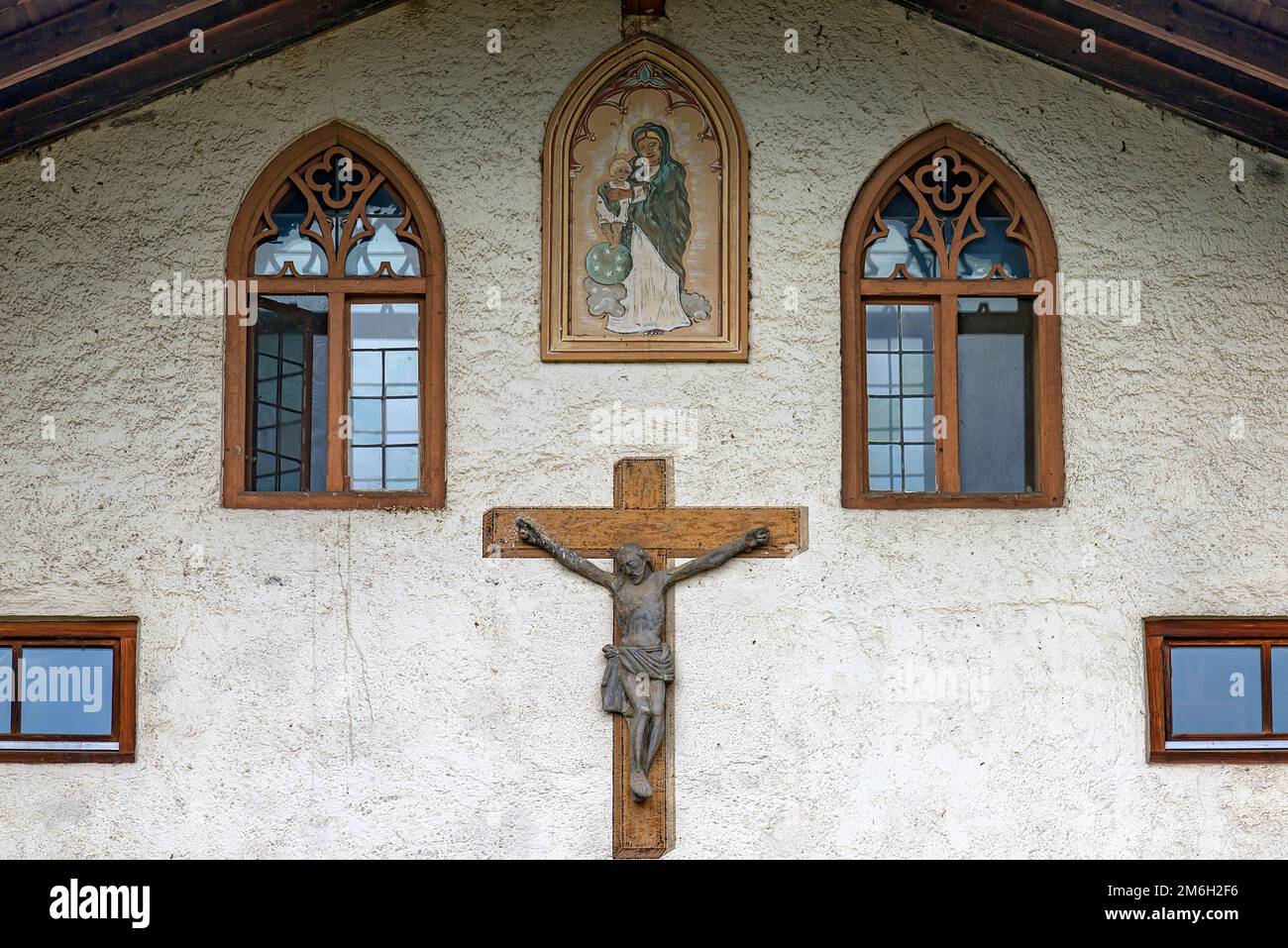 Holy figures and neo-Gothic window frames on a farmhouse, Seeon ...