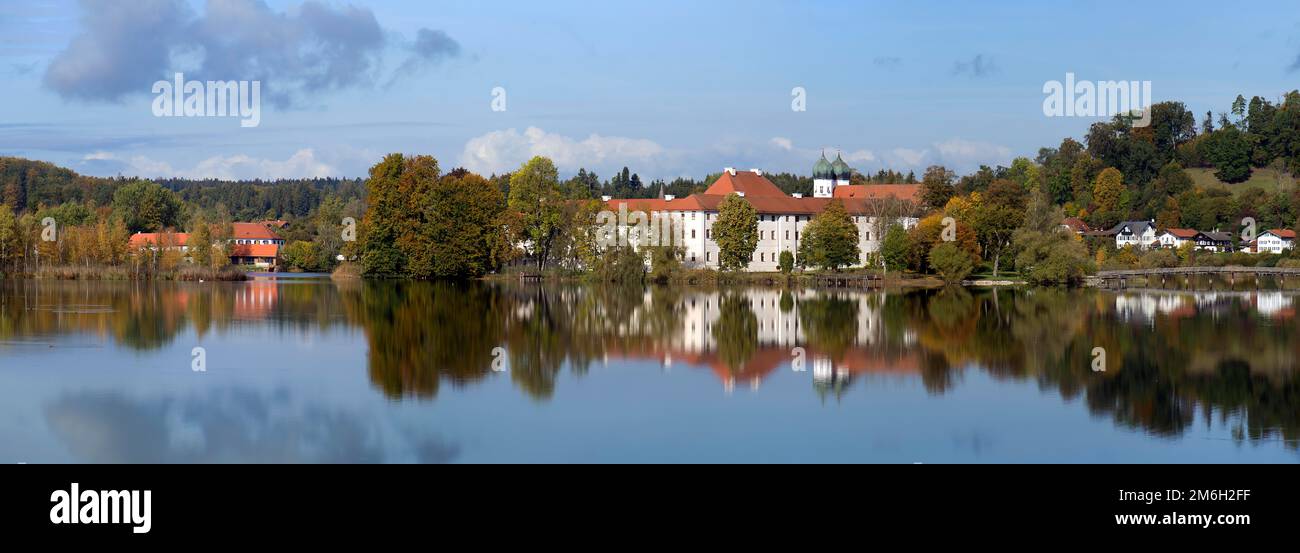 Panoramic view of Seeon Monastery with reflection in Kolstersee, Seeon ...