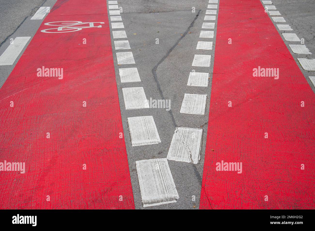 Cycle path with red marking Stock Photo - Alamy