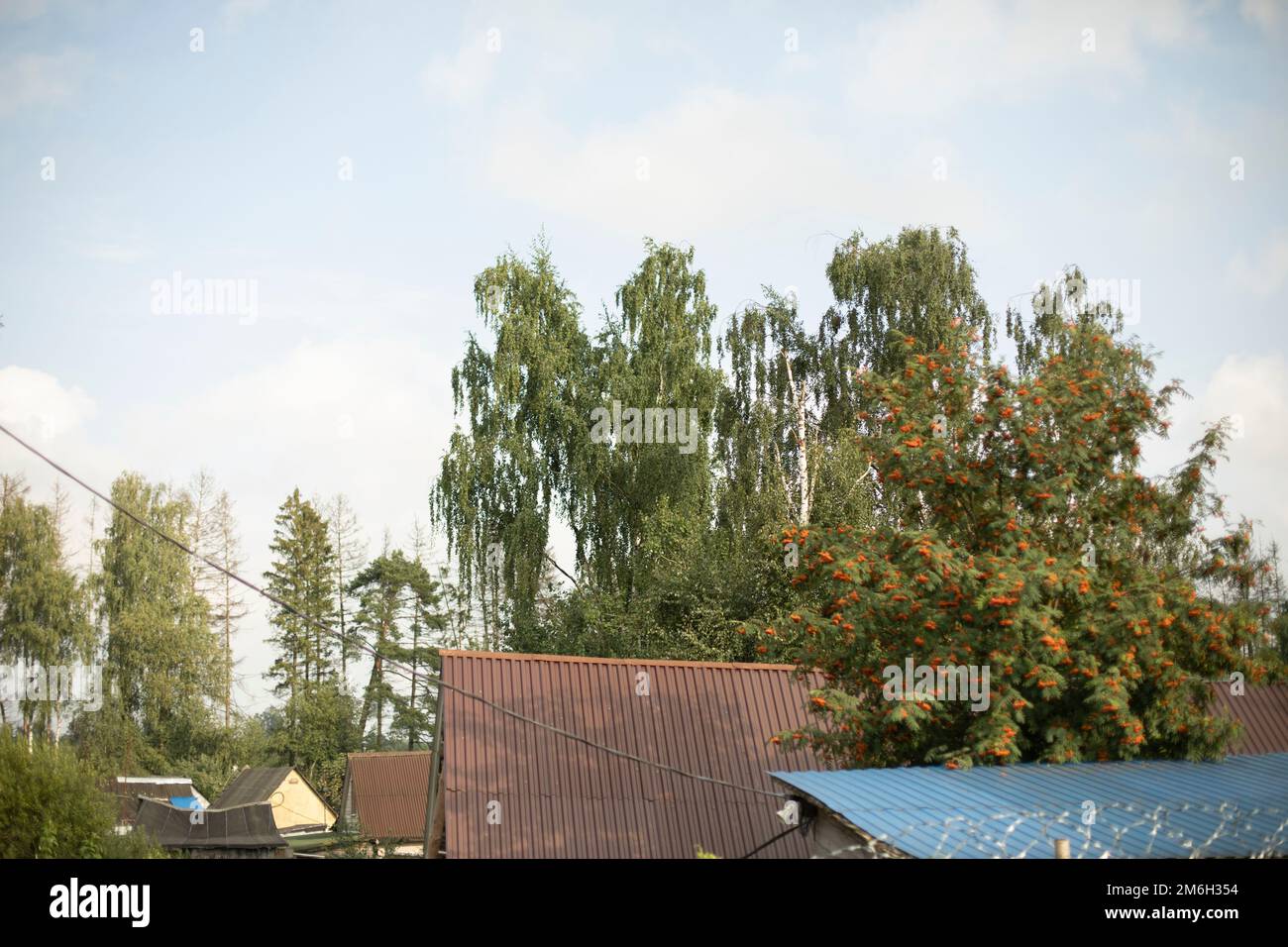 House in village. Summer in countryside. Simple house to live outside ...