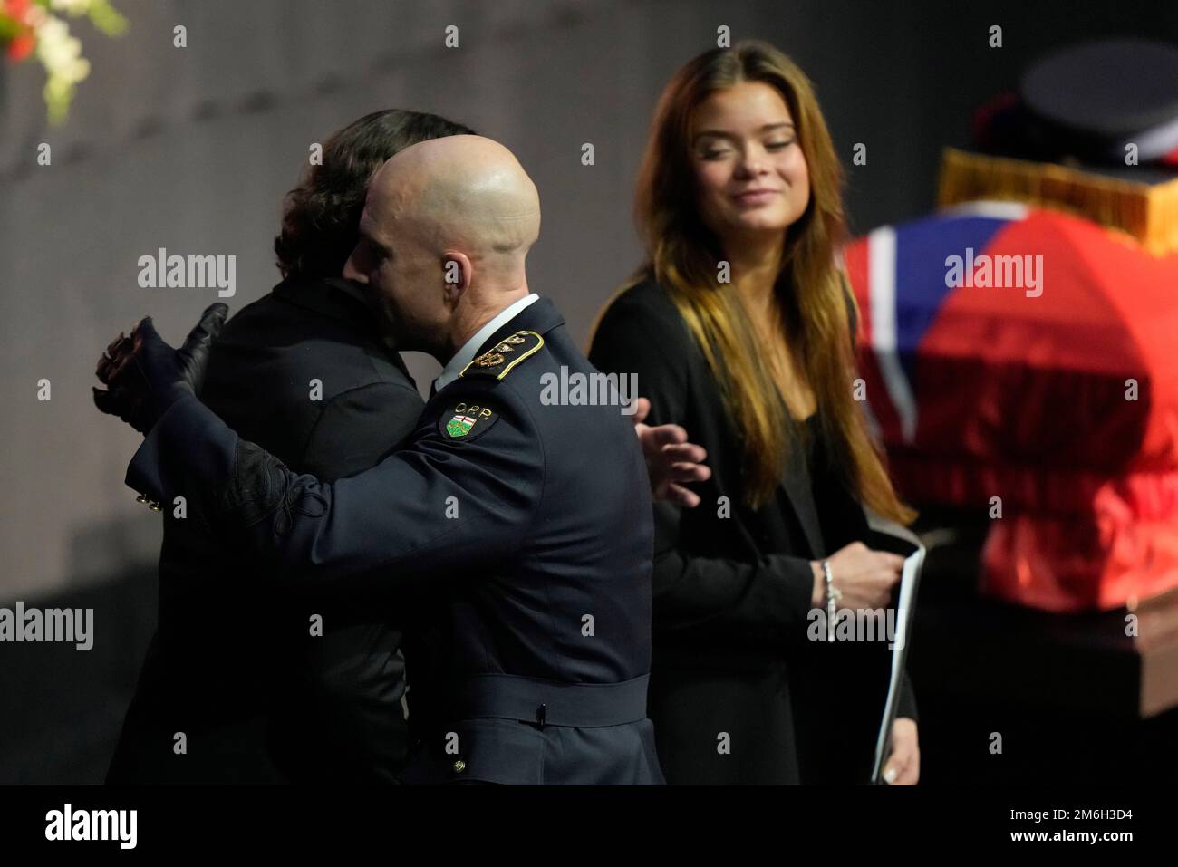 OPP commissioner Thomas Carrique hugs Michal Pierzchala, brother of OPP ...