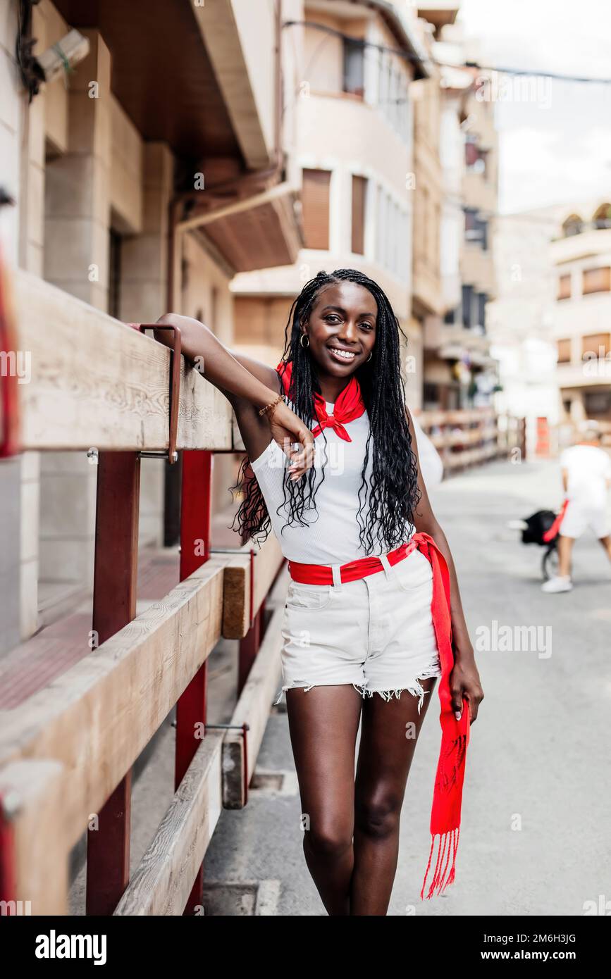 portrait of a black girl resting during the running of the bulls in the ...