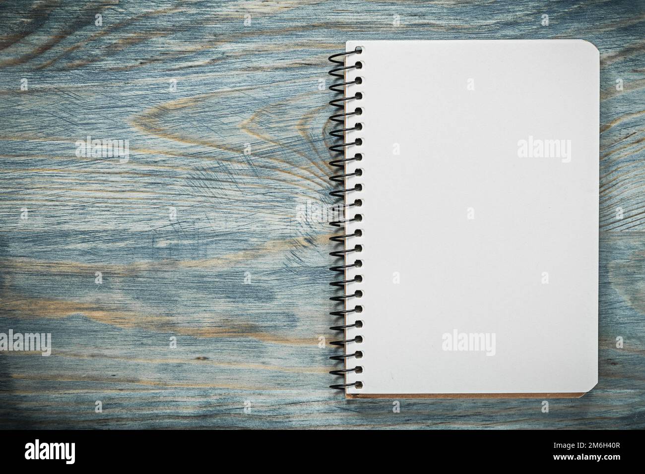 Blank notepad on wooden board office concept Stock Photo - Alamy
