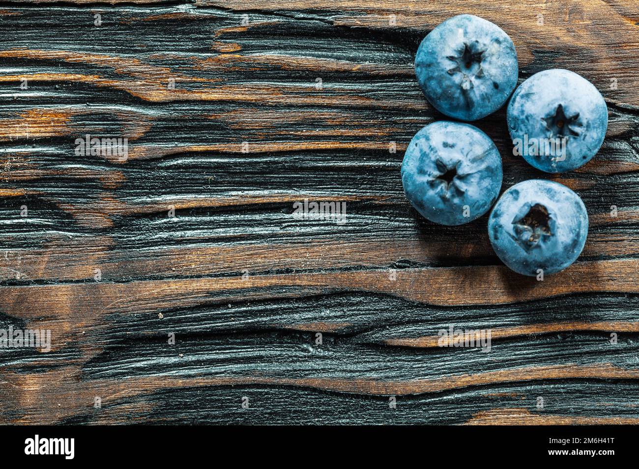 Blueberries on vintage wooden board Stock Photo - Alamy