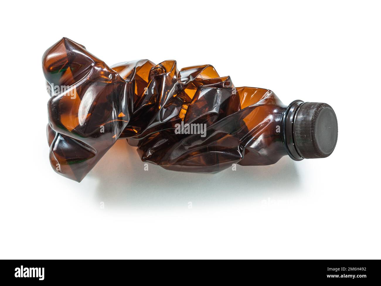 brown crumpled plastic bottle isolated Stock Photo - Alamy