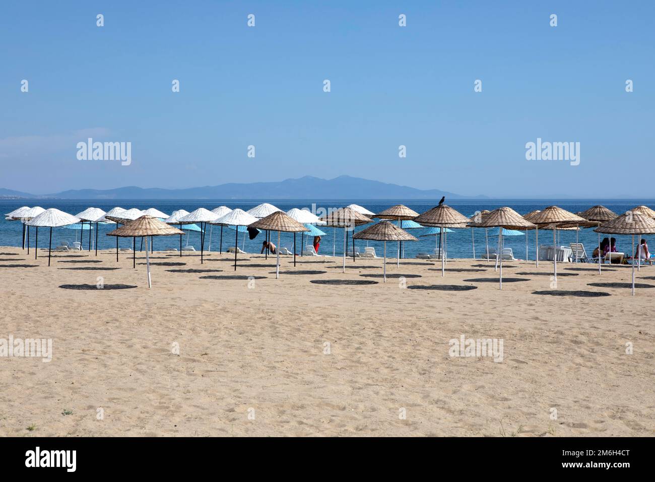 Straw parasols on the sandy beach on the Aegean Sea, Sarimsakli Plaji ...