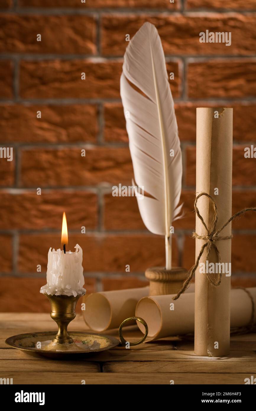 candle with antique writing accessries Stock Photo - Alamy