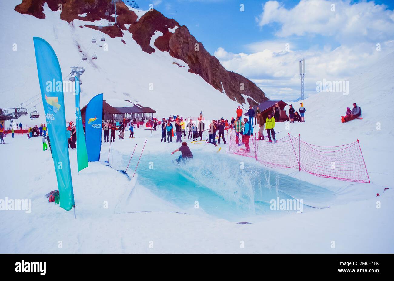 Russia, Sochi 11.05.2019. A fat guy is skiing on the water of the pool ...