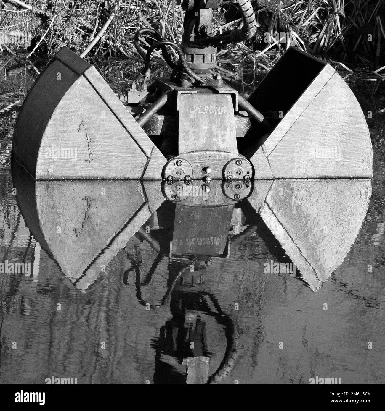 a part submerged dredging bucket on the Stroudwater Navigation Canal ...