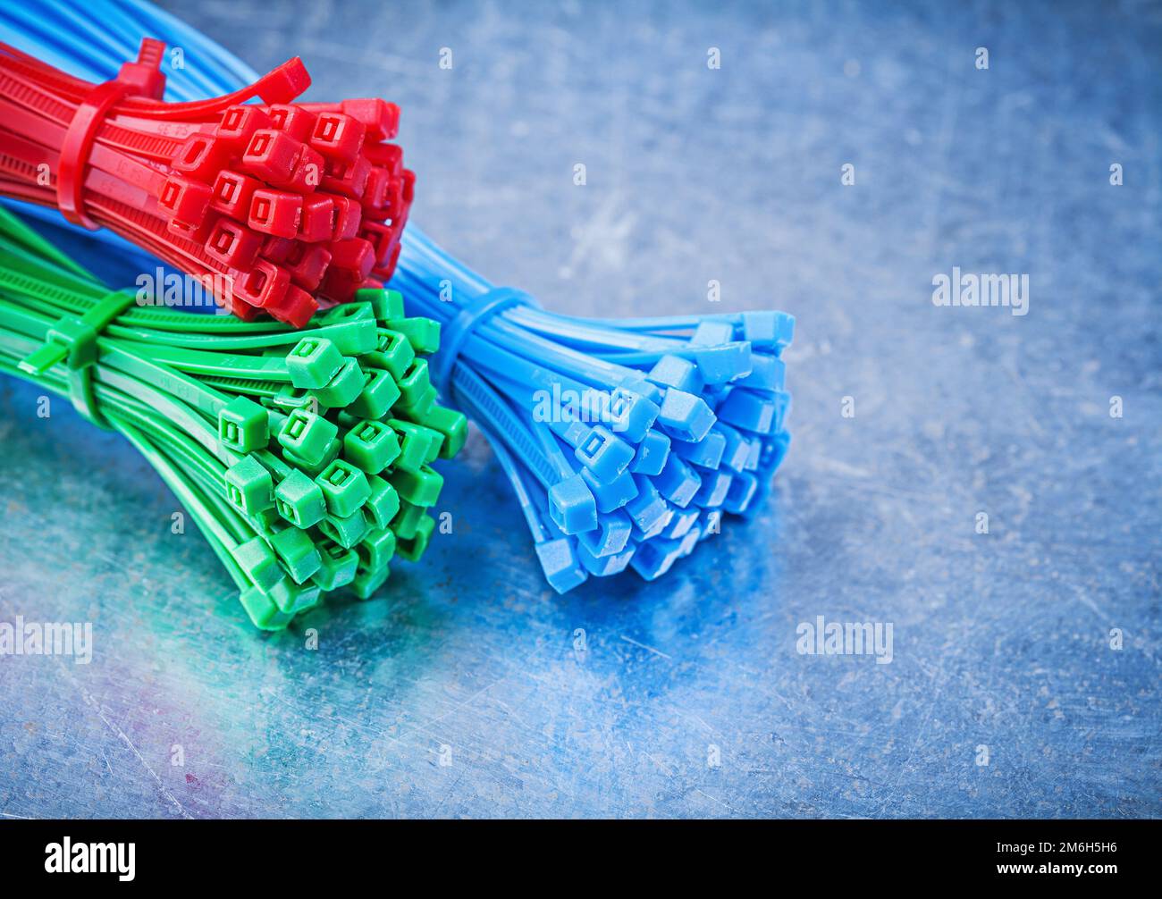Horizontal view of cable ties on metallic background construction ...