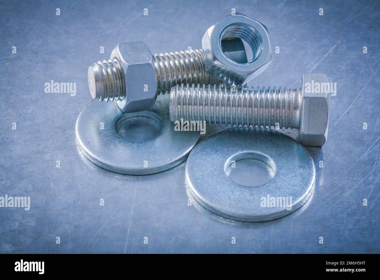 Horizontal view of bolt washers screwbolts screw-nuts on metallic ...