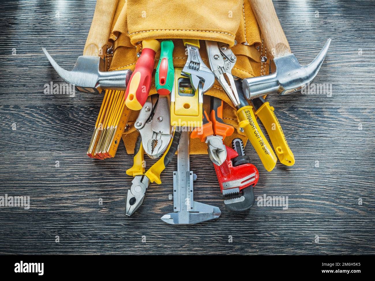 Leather building belt construction tooling on wooden background Stock ...