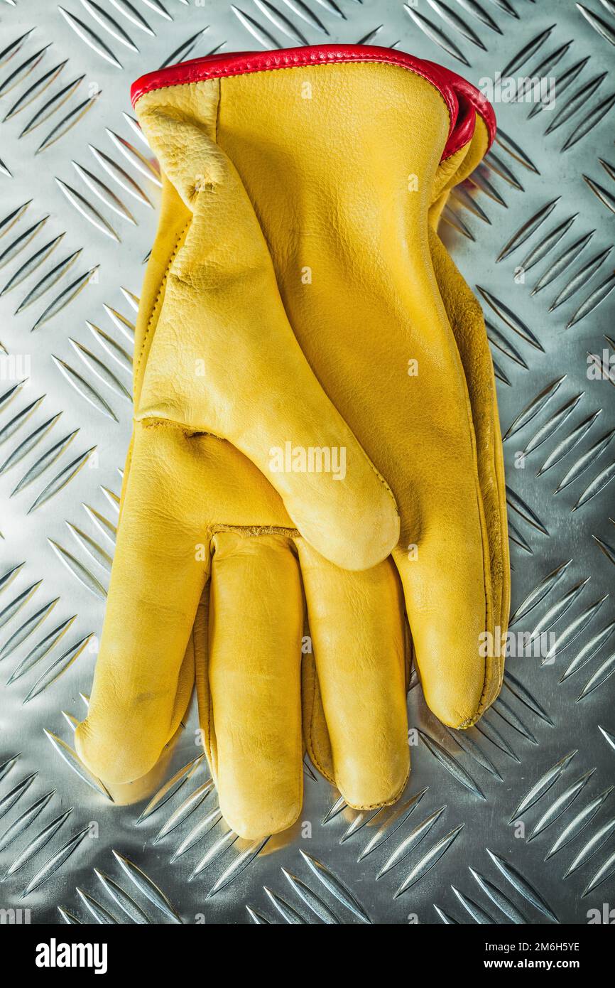 Leather safety gloves on corrugated metal texture Stock Photo - Alamy